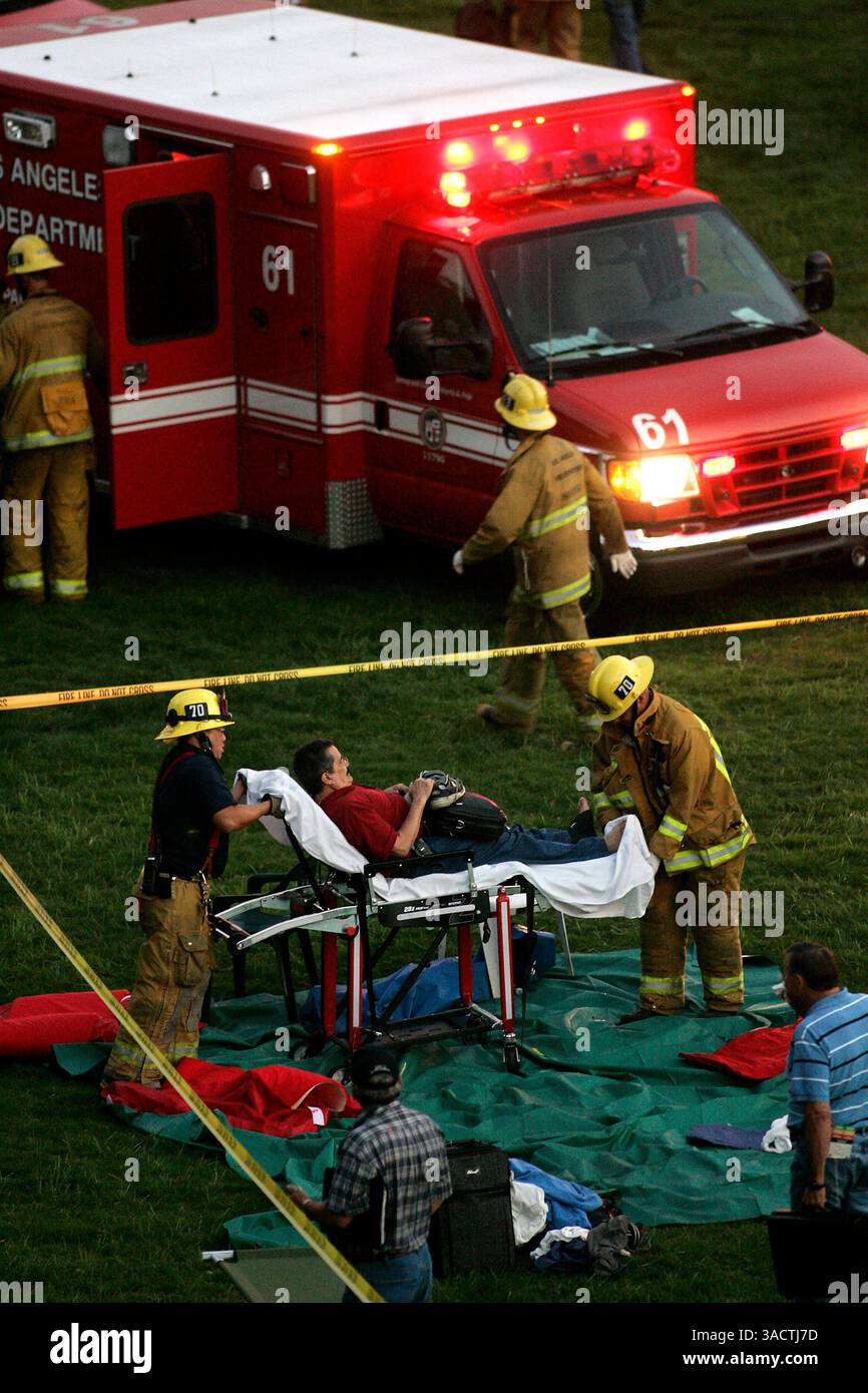Sep 12, 2008 - Los Angeles, California, USA - Rescue workers assist an ...