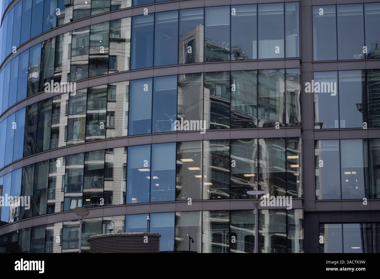 Reflections of buildings in windows at Paddington Basin London Stock ...