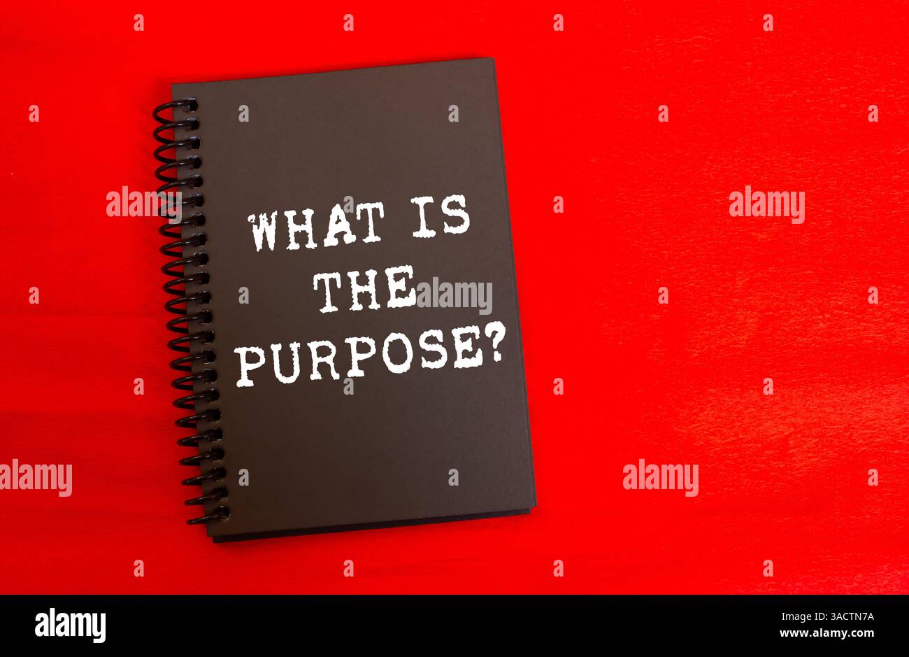 What is the purpose message written on black notebook page on red ...