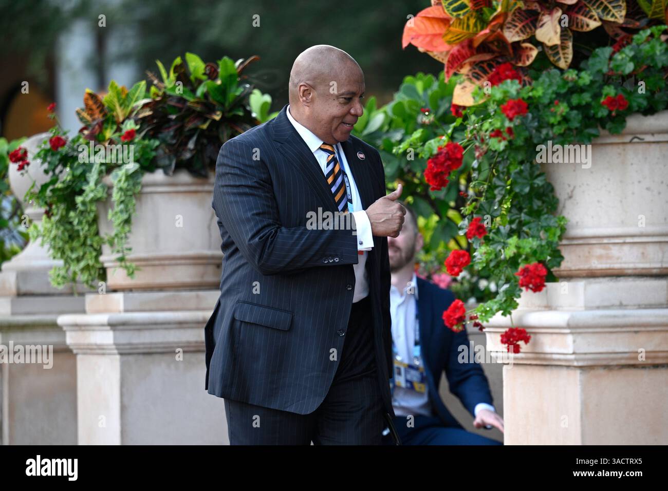 Chicago Bears president Kevin Warren walks to an interview at the 2025 ...
