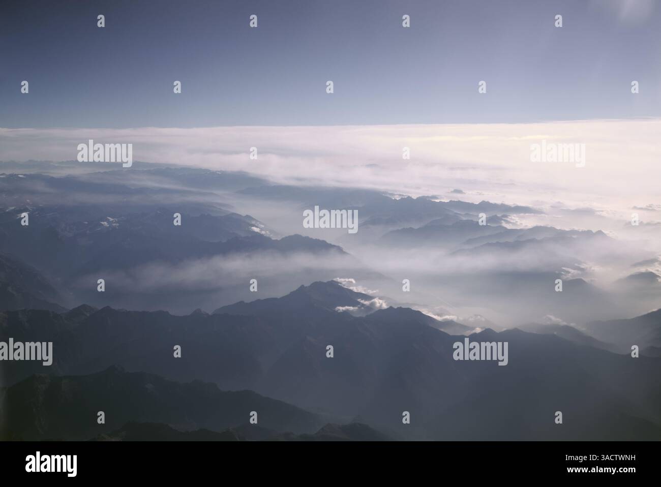 Aerial photo above the clouds with a view of the Alps Stock Photo - Alamy