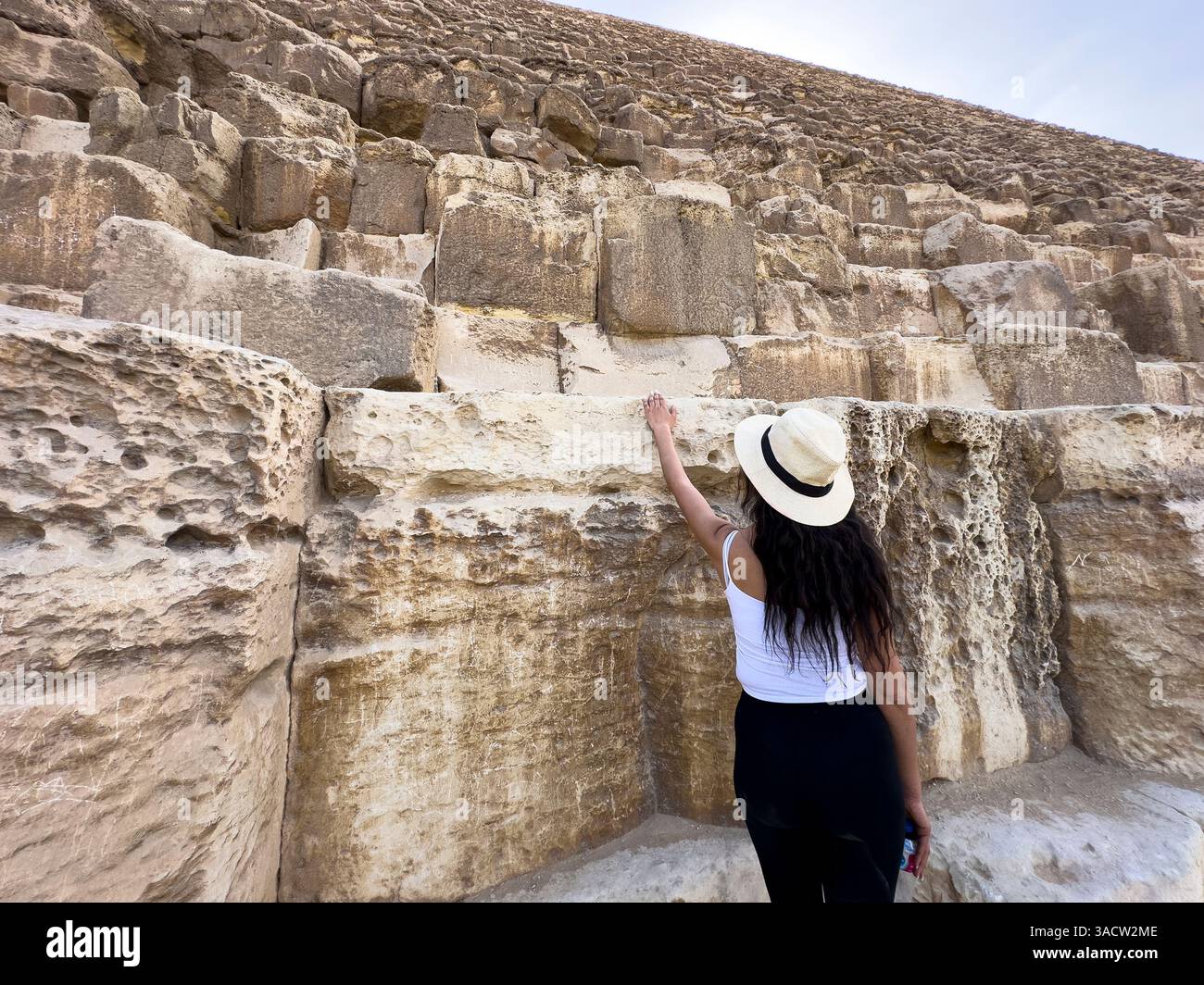 Cairo, Egypt; January 20, 2024: Feel the touch of Keops Pyramid as a ...