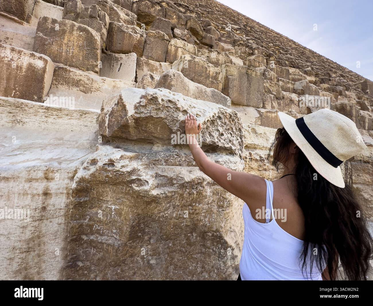 Cairo, Egypt; January 20, 2024: Experience a tourist touching and ...