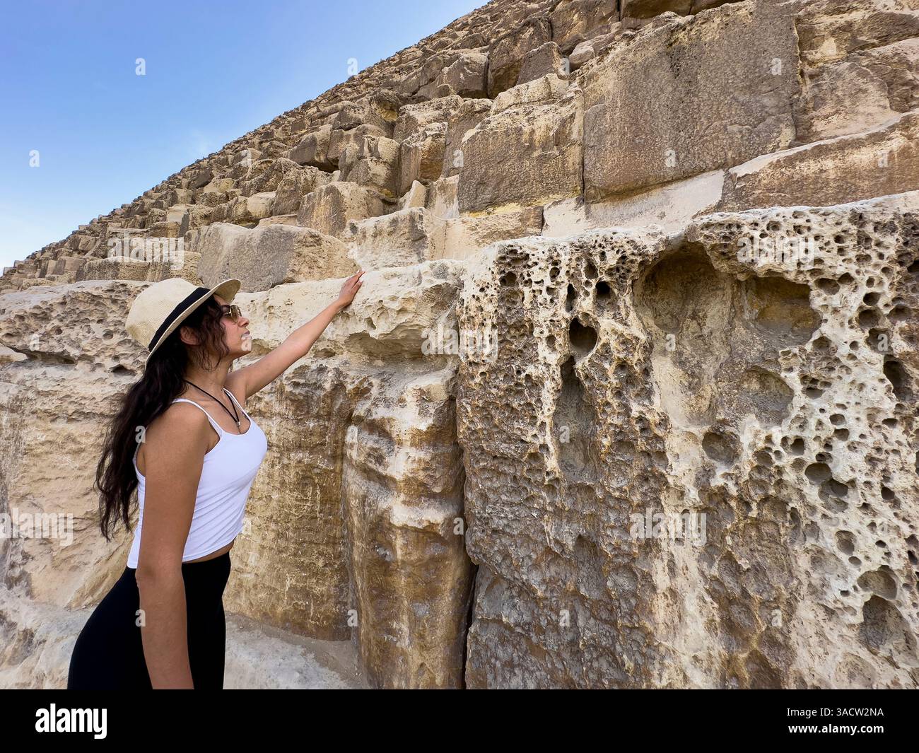 Cairo, Egypt; January 20, 2024: Make a tourist's Keops connection by touching a modern world ...