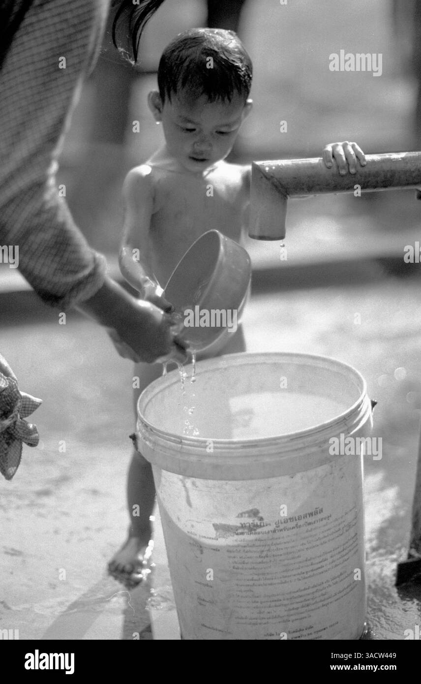 Dec 15, 2003; Srayong Cheung, CAMBODIA; Family using water pump. Wells ...