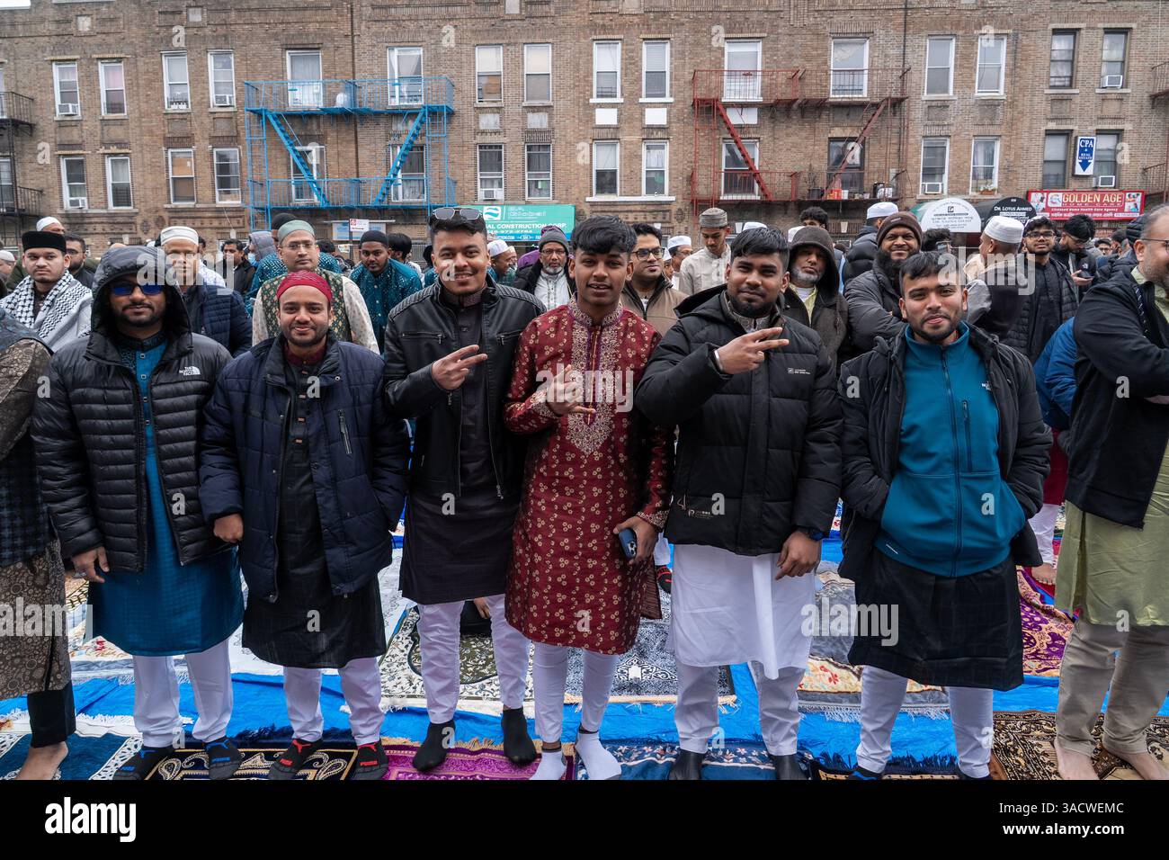 Muslim men pray on Eid on McDonald Ave in Brooklyn NY in the "Little ...