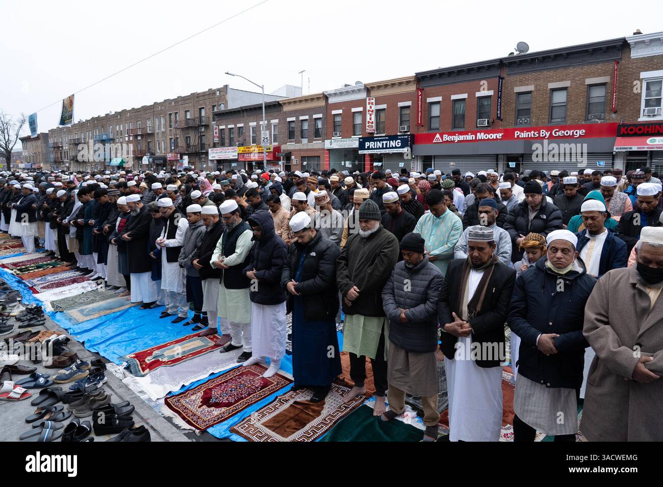Muslim men pray on Eid on McDonald Ave in Brooklyn NY in the "Little ...