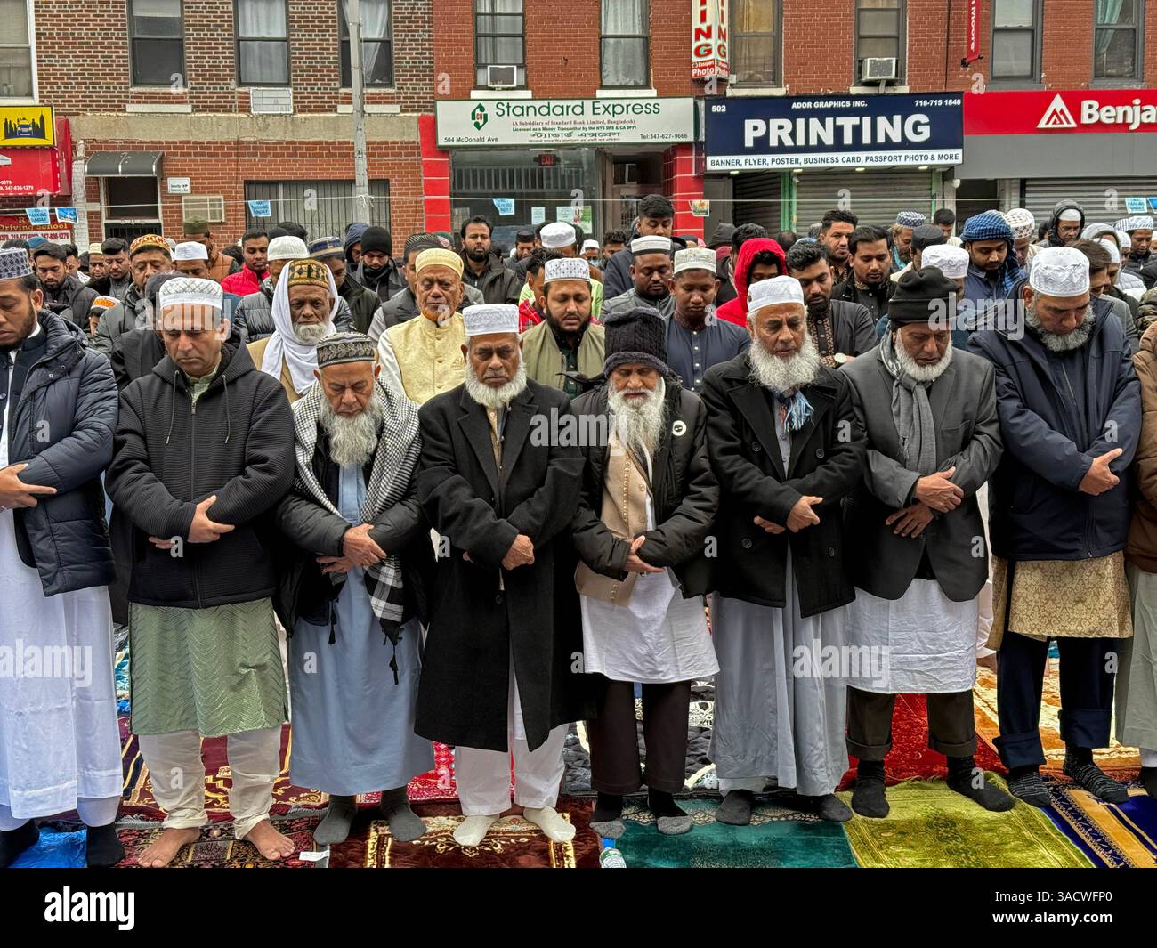 Muslim men pray on Eid on McDonald Ave in Brooklyn NY in the "Little ...