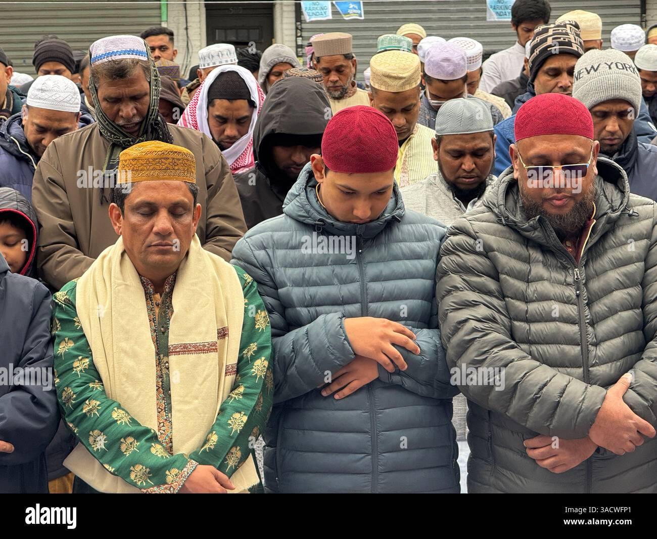 Muslim men pray on Eid on McDonald Ave in Brooklyn NY in the "Little ...