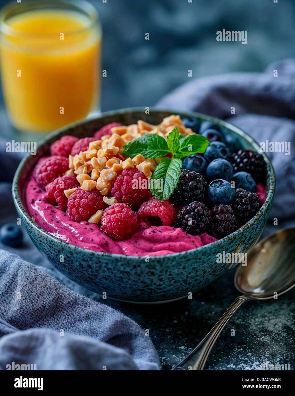 Healthy Smoothie Bowl With Mixed Berries, Nuts, and Fresh Mint Garnish ...