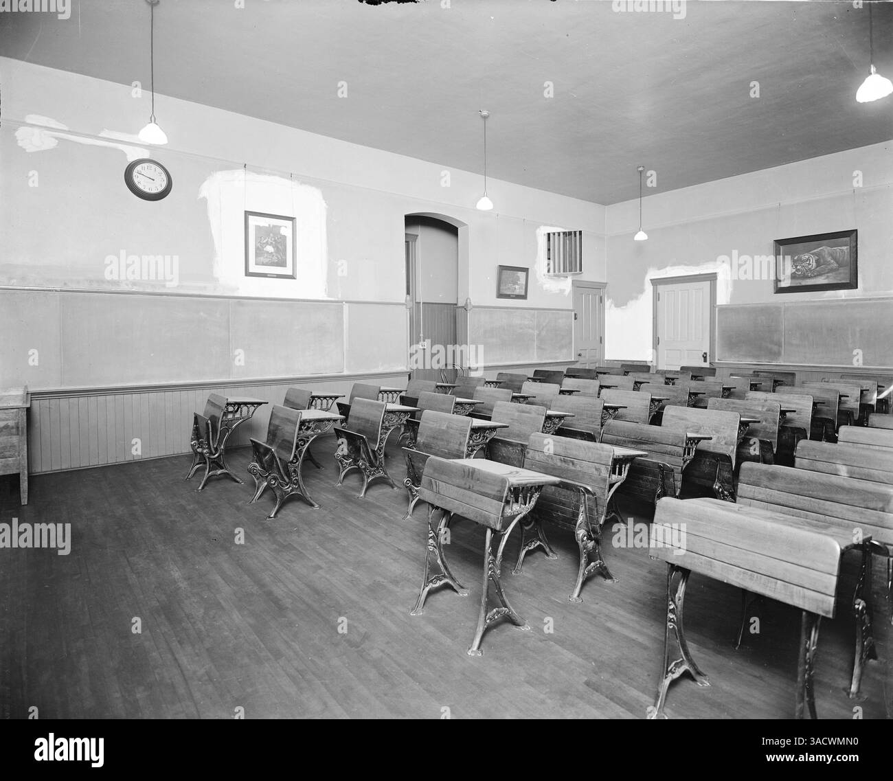 The image depicts a classroom at Calhoun School, showcasing an unclean ...