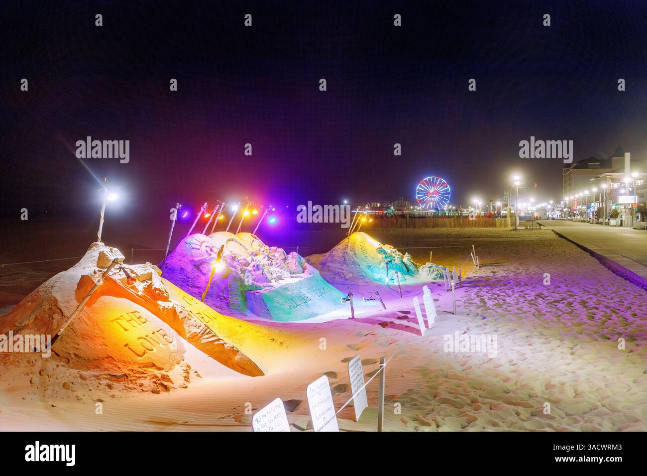 Boardwalk, beach with sand sculptures and Fishing Pier with Ferris ...