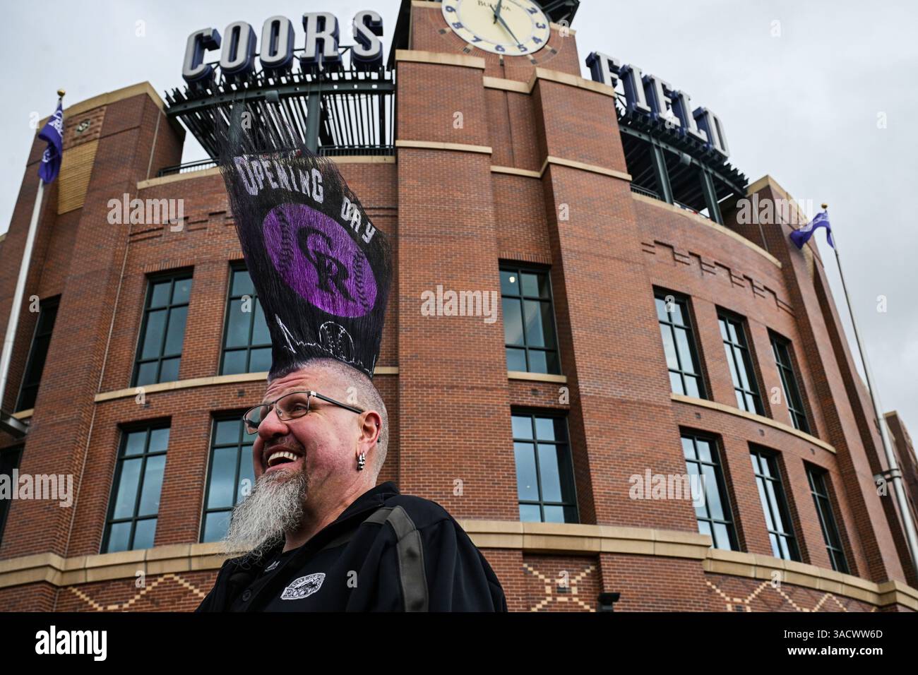 Joshua Pugh poses for photos outside Coors Field before the Colorado ...