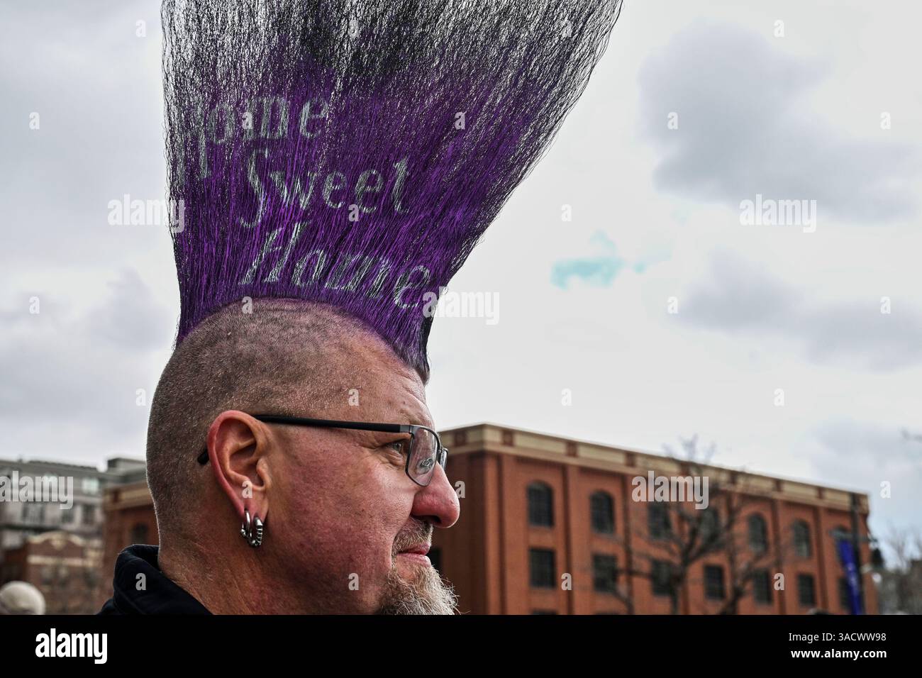 Joshua Pugh poses for photos outside Coors Field before the Colorado ...