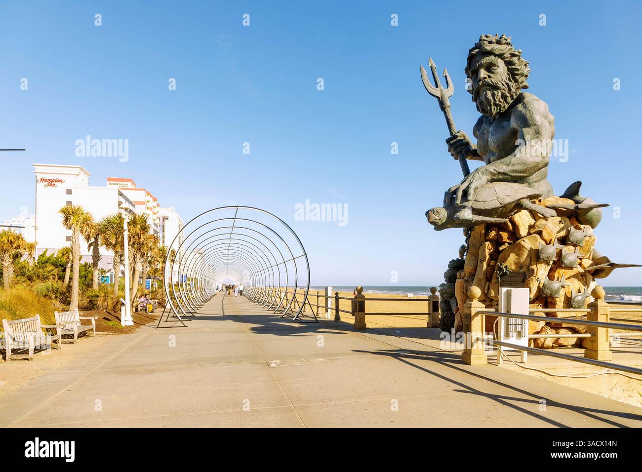Bronze statue of King Neptune and boardwalk on Virginia Beach, Princess ...