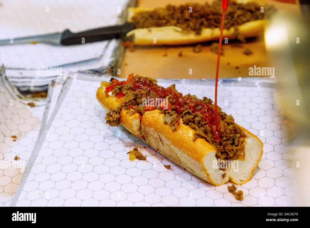 Preparing cheesesteaks at a food stand in the Reading Terminal Market ...