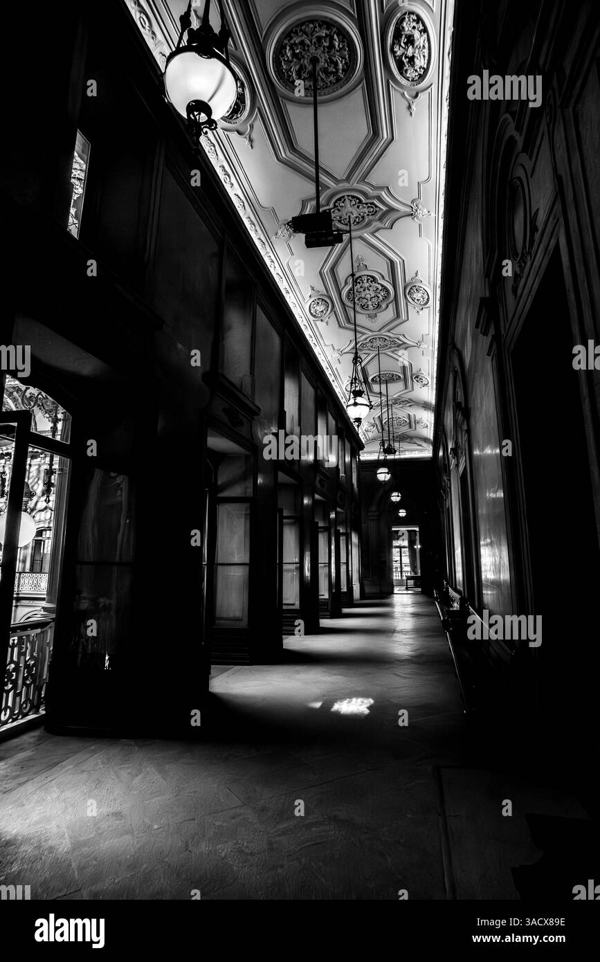 An eerie looking hallway in an abandoned old palace somewhere in Europe ...