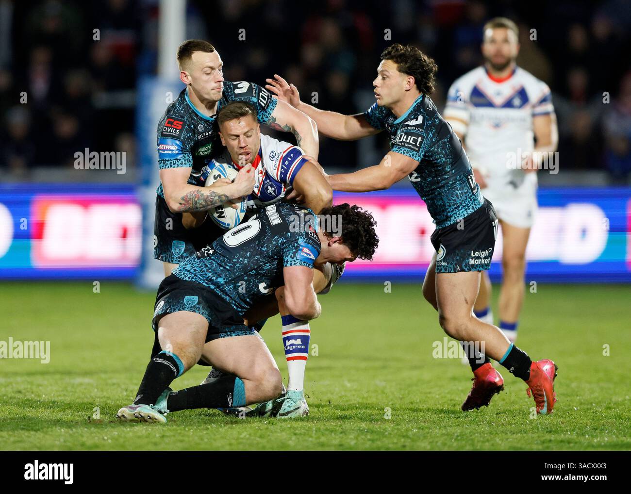 Wakefield Trinity's Matty Russell is tackled during the Betfred ...