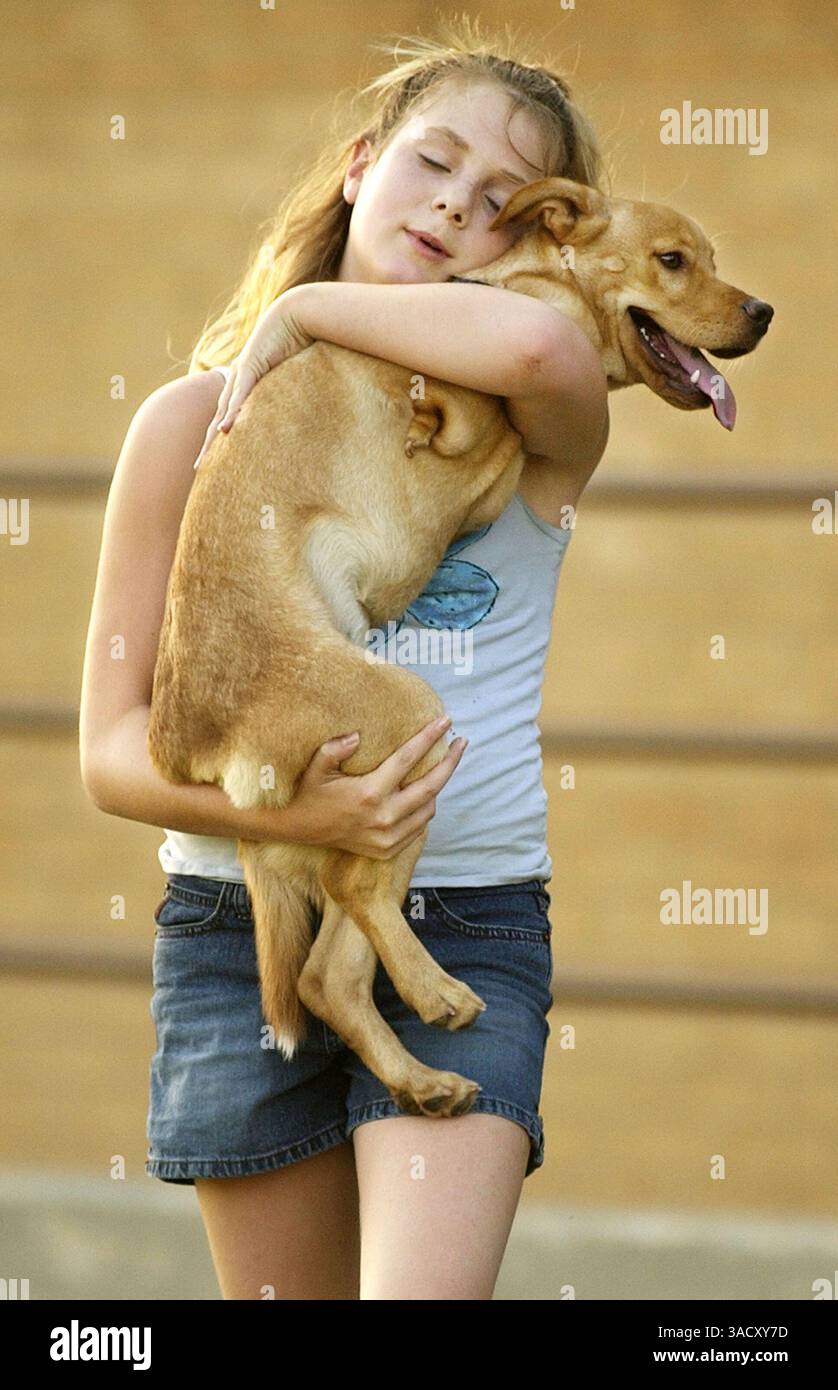 Jul 05, 2003; Oklahoma City, OK, USA; LAURA STRINGFELLOW, 14, hugs her ...