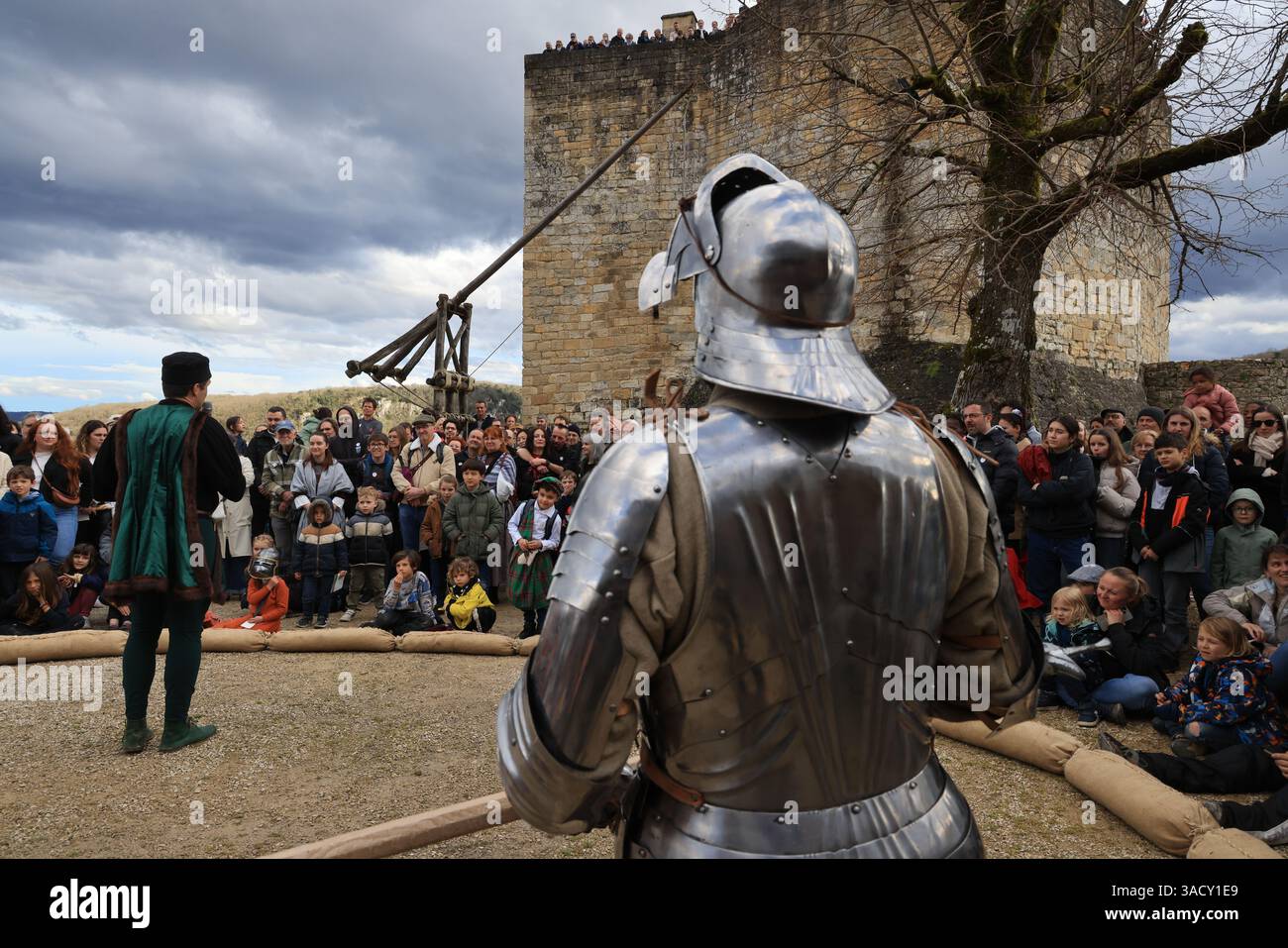 Armored knights fight at the medieval castle of Castelnaud in Périgord ...