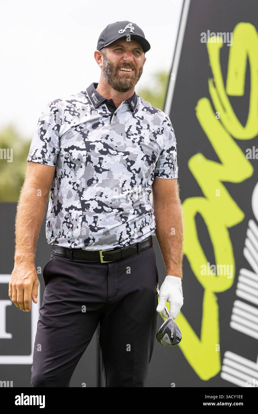 Captain Dustin Johnson of 4Aces GC watches his shot from the fifth tee ...