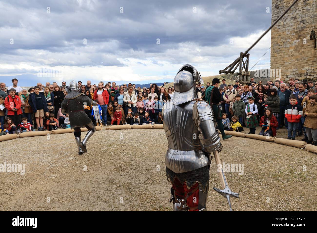 Armored knights fight at the medieval castle of Castelnaud in Périgord ...