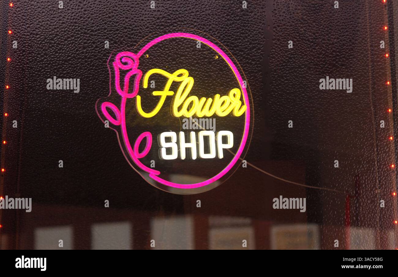 Neon Flower Shop Sign in Window of Florist Shop Stock Photo - Alamy