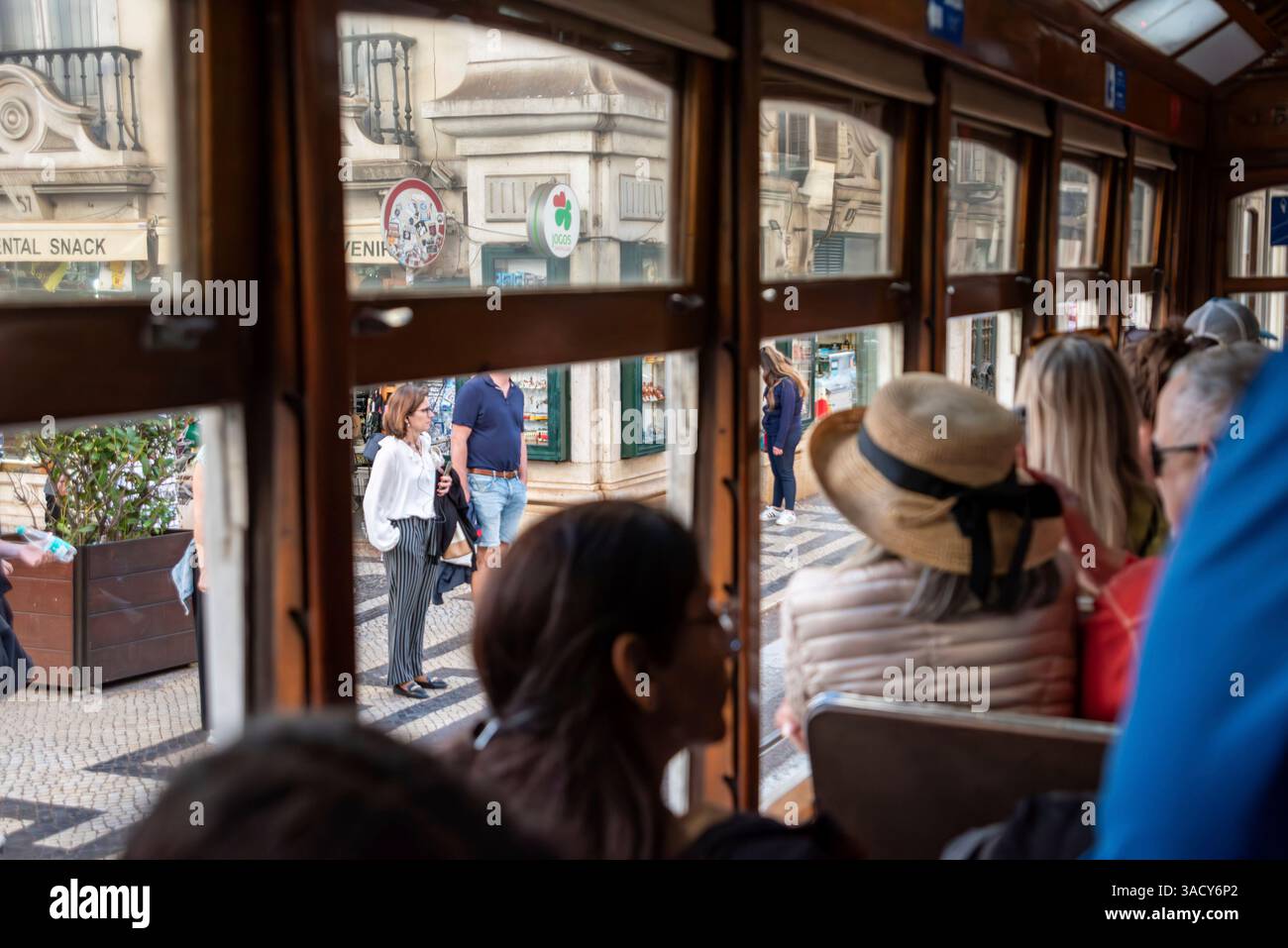 Passengers looking out tram hi-res stock photography and images - Alamy