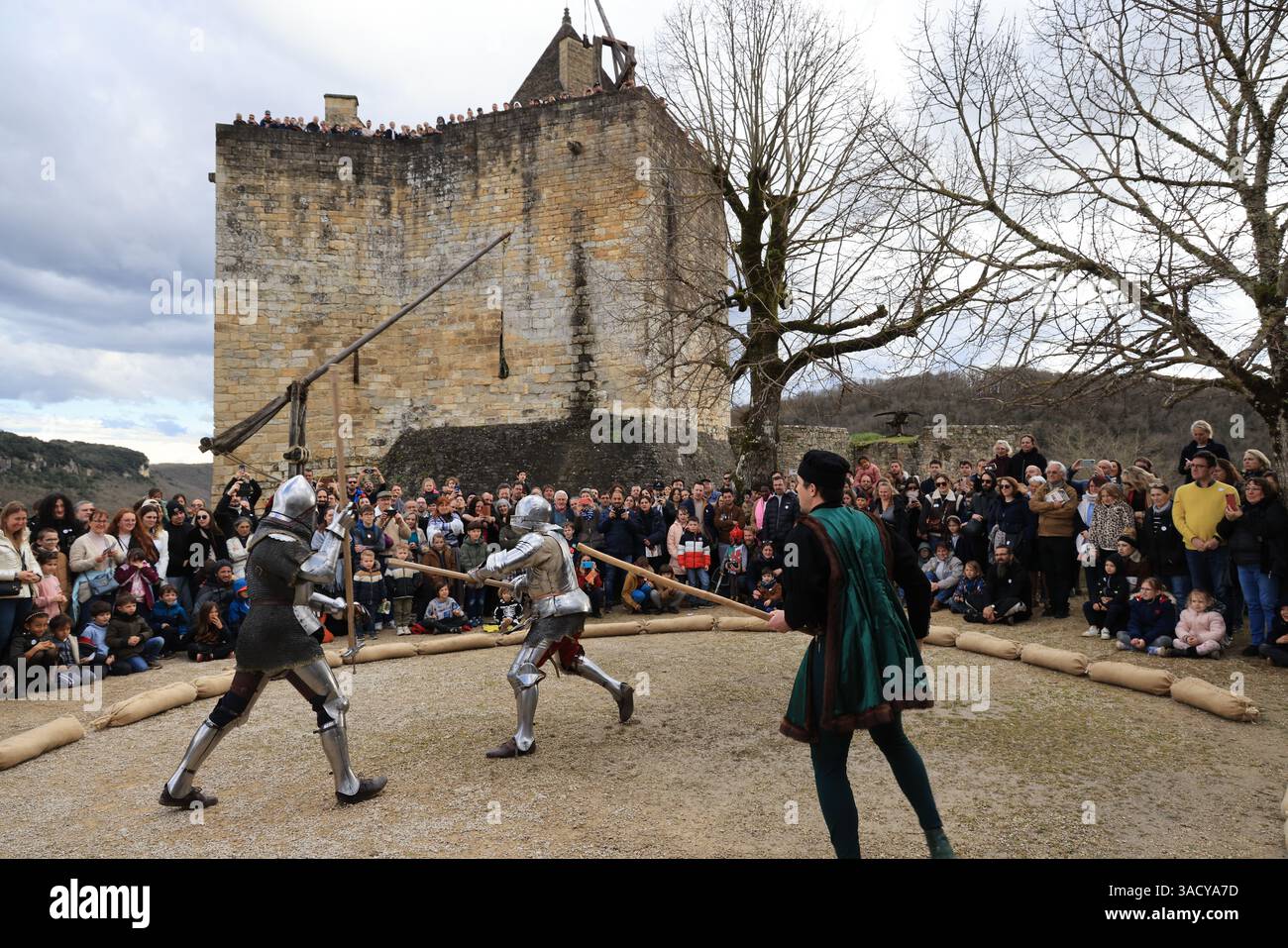 Armored knights fight at the medieval castle of Castelnaud in Périgord ...