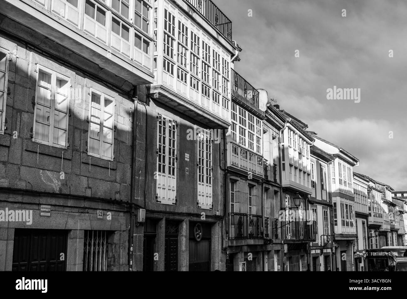 Charming San Pedro street with historic Spanish houses featuring stone ...