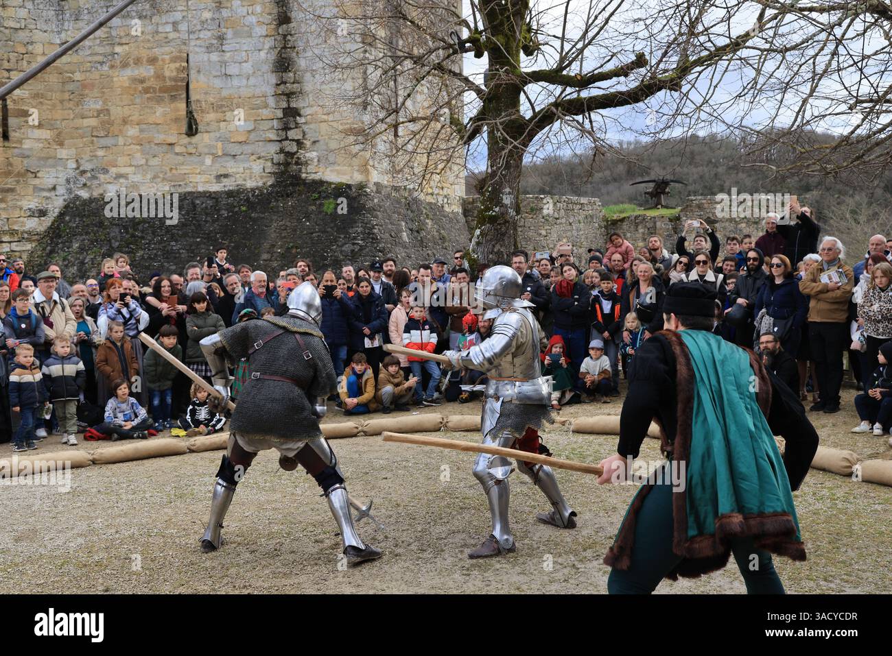 Armored knights fight at the medieval castle of Castelnaud in Périgord ...