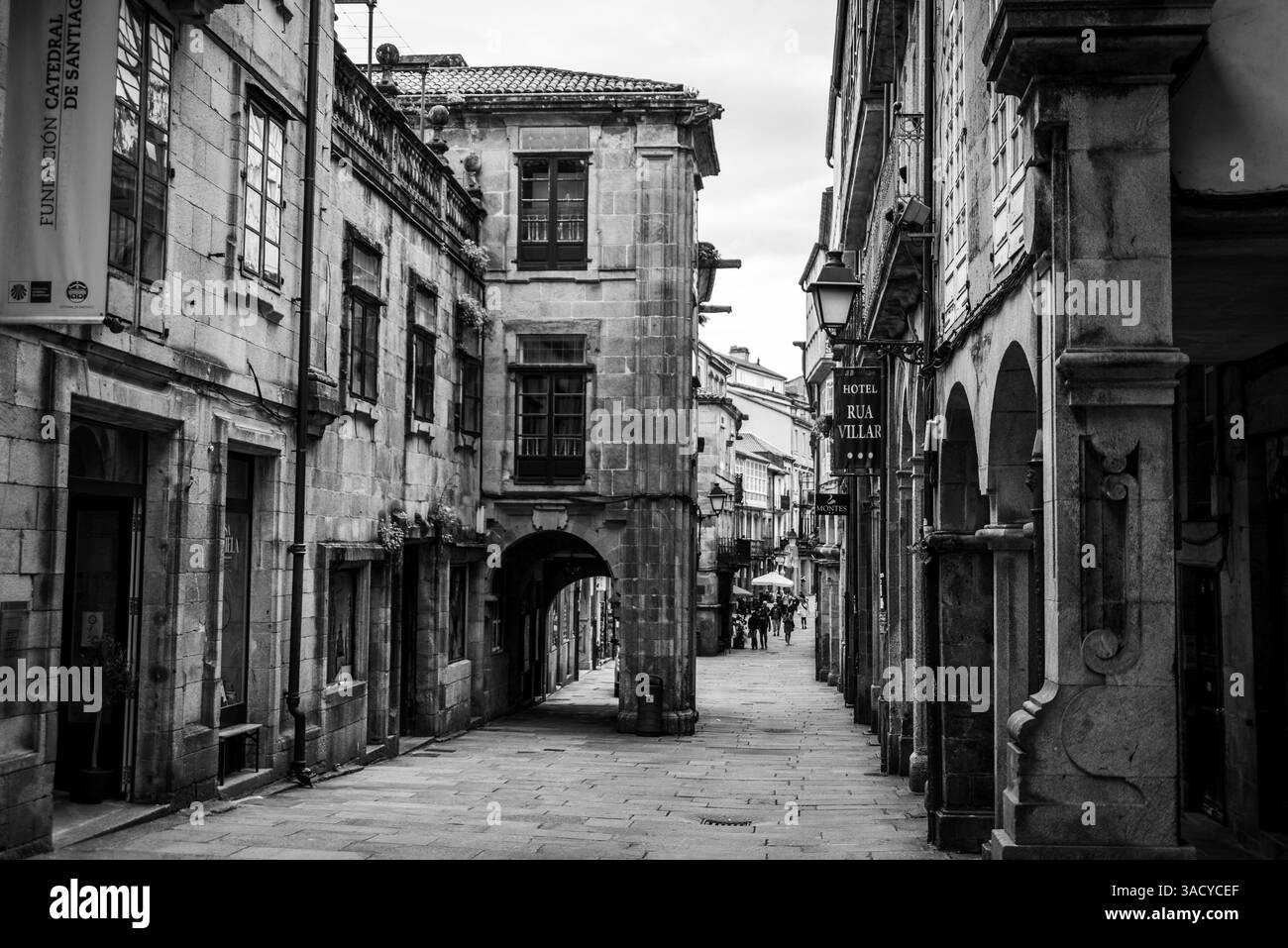 Historic medieval alleyway with old houses in the city center of ...