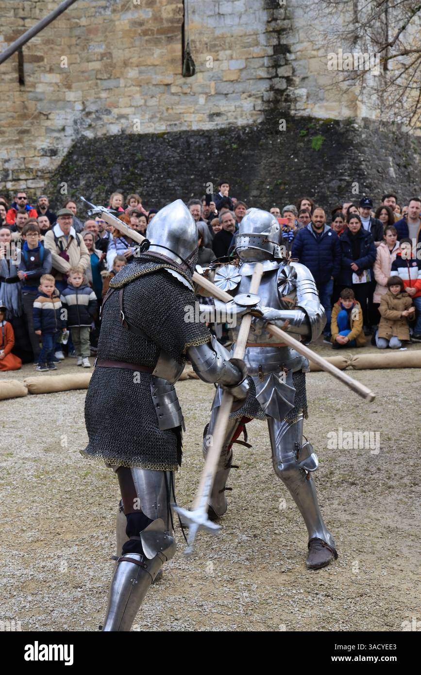 Armored knights fight at the medieval castle of Castelnaud in Périgord ...
