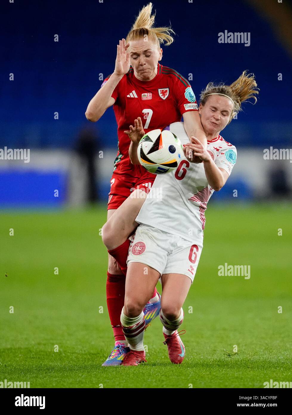 Wales' Ceri Holland (left) and Denmark's Josefine Hasbo (right) battle ...