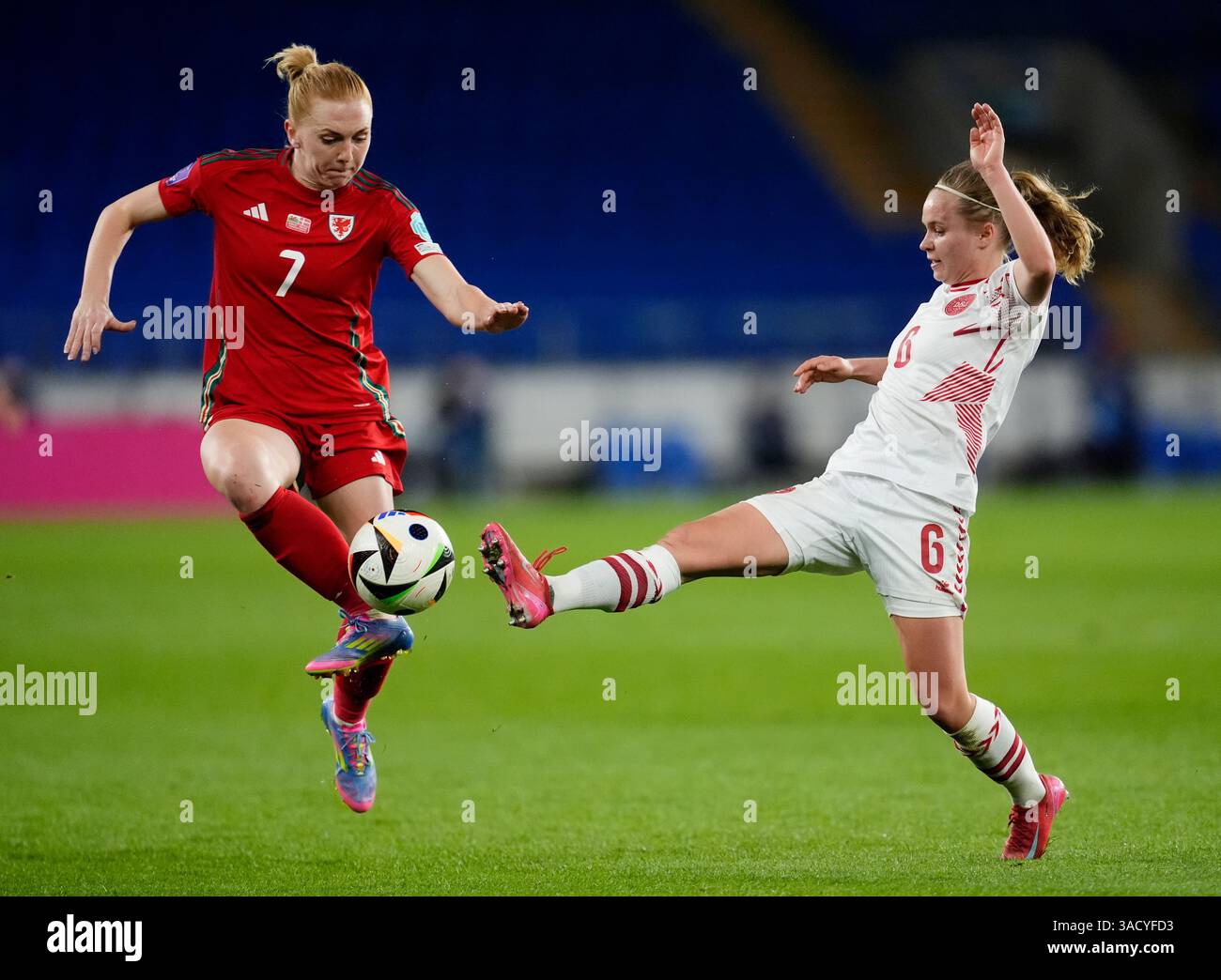 Wales' Ceri Holland (left) and Denmark's Josefine Hasbo (right) battle ...