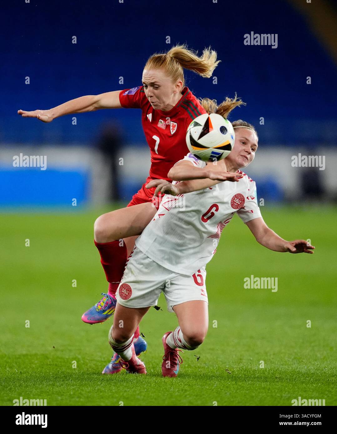 Wales' Ceri Holland (left) and Denmark's Josefine Hasbo (right) battle ...