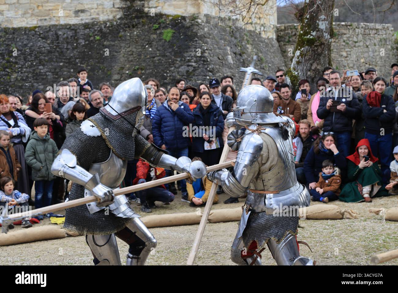 Armored knights fight at the medieval castle of Castelnaud in Périgord ...