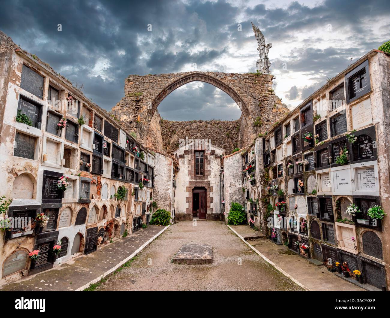 Comillas, Spain, Sliding graves at the old historic stone cemetery in Comillas, Cantabria in ...