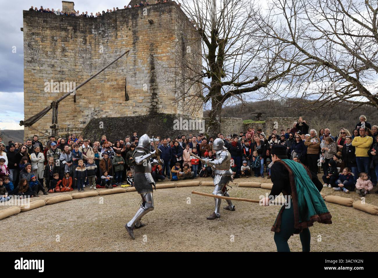 Armored knights fight at the medieval castle of Castelnaud in Périgord ...