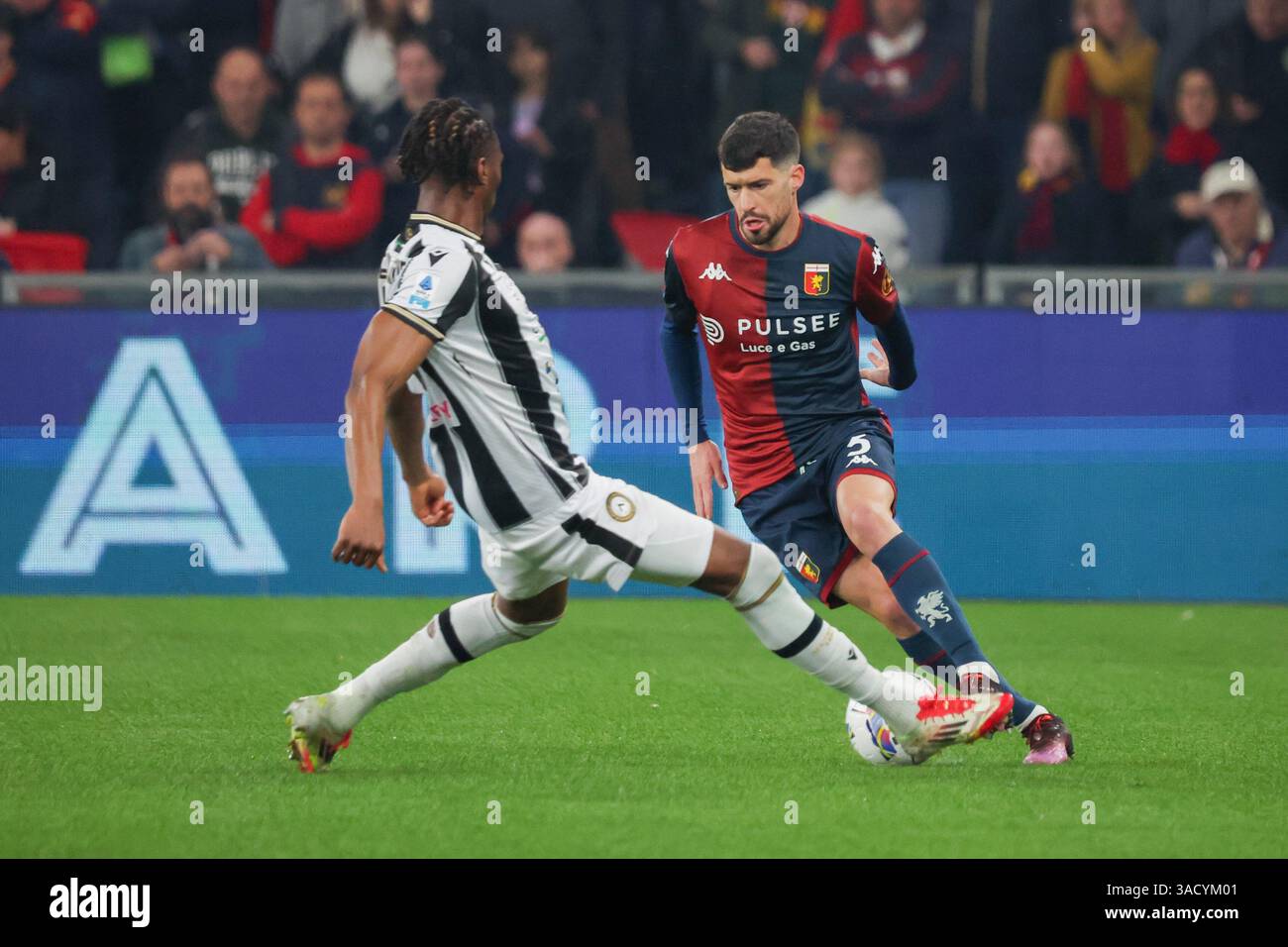 Genoa’s Aaron Martin fights for the ball with Udinese's Kingsley ...