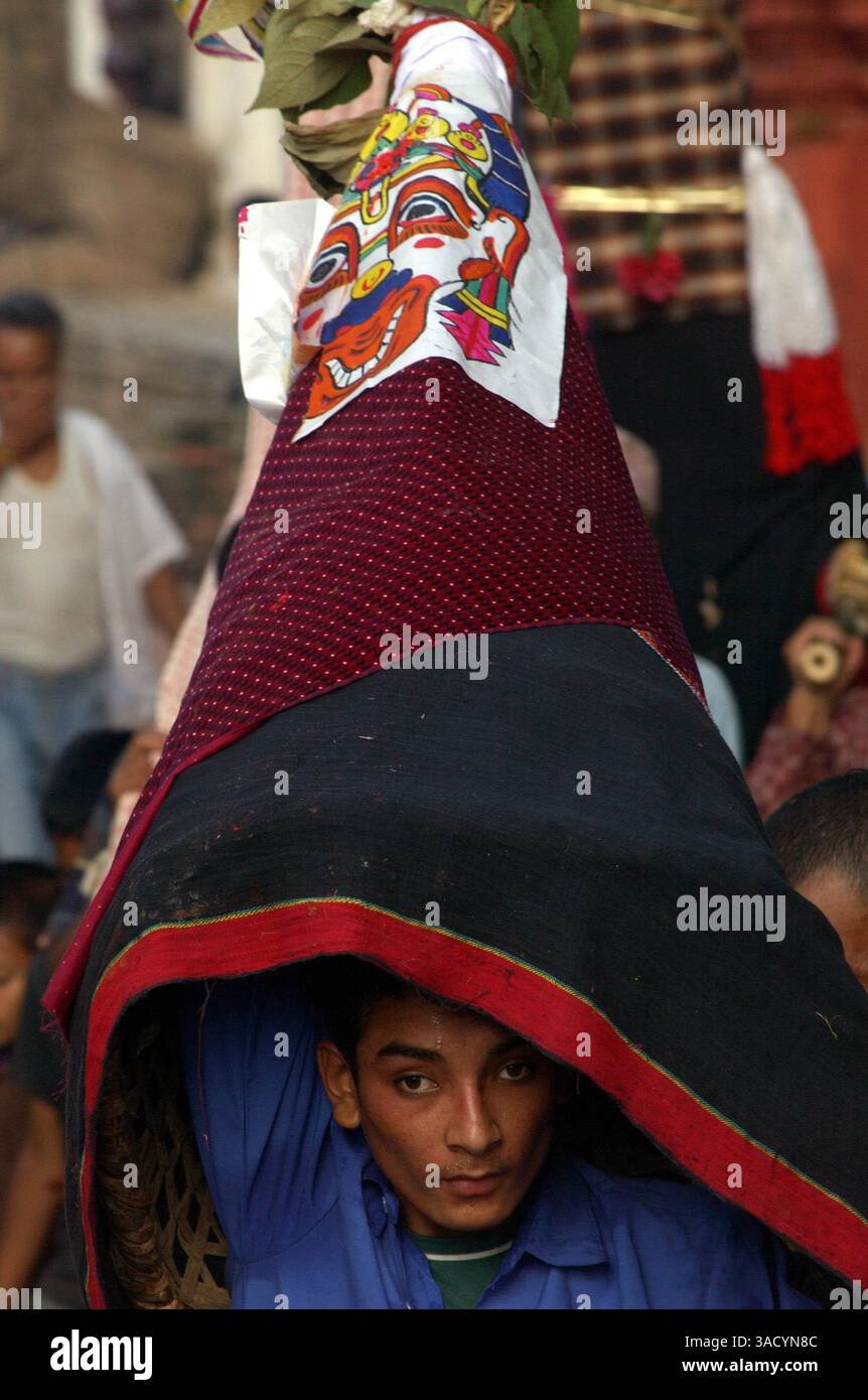 Aug 13, 2003; Bhaktapur, Kathmandu, Nepal; A Nepalese carries an ...