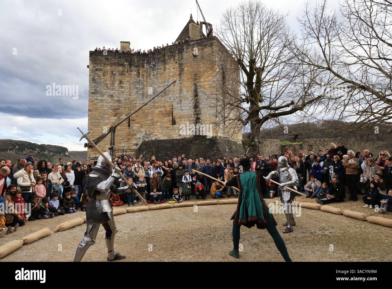 Armored knights fight at the medieval castle of Castelnaud in Périgord ...
