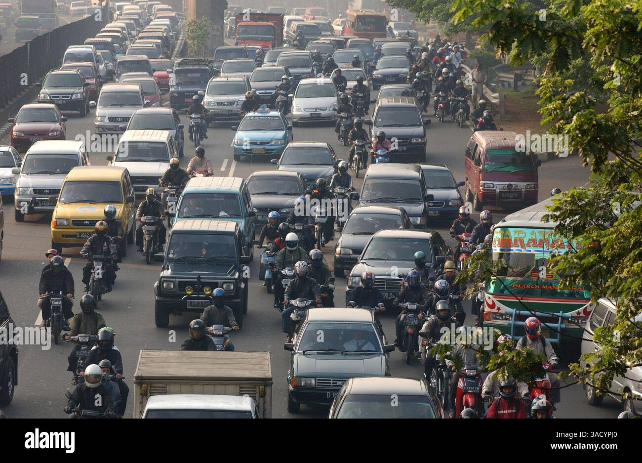 Jun 16, 2004; Jakarta, Indonesia; Motorcycle riders in the mid of ...
