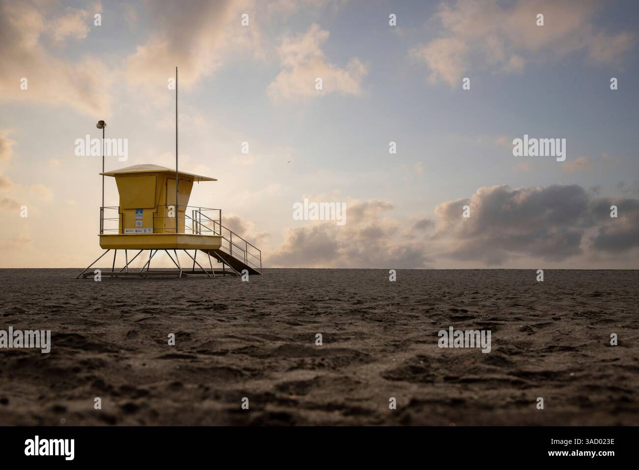 Landscape by the sea, city beach with yellow lifeguard huts on the ...