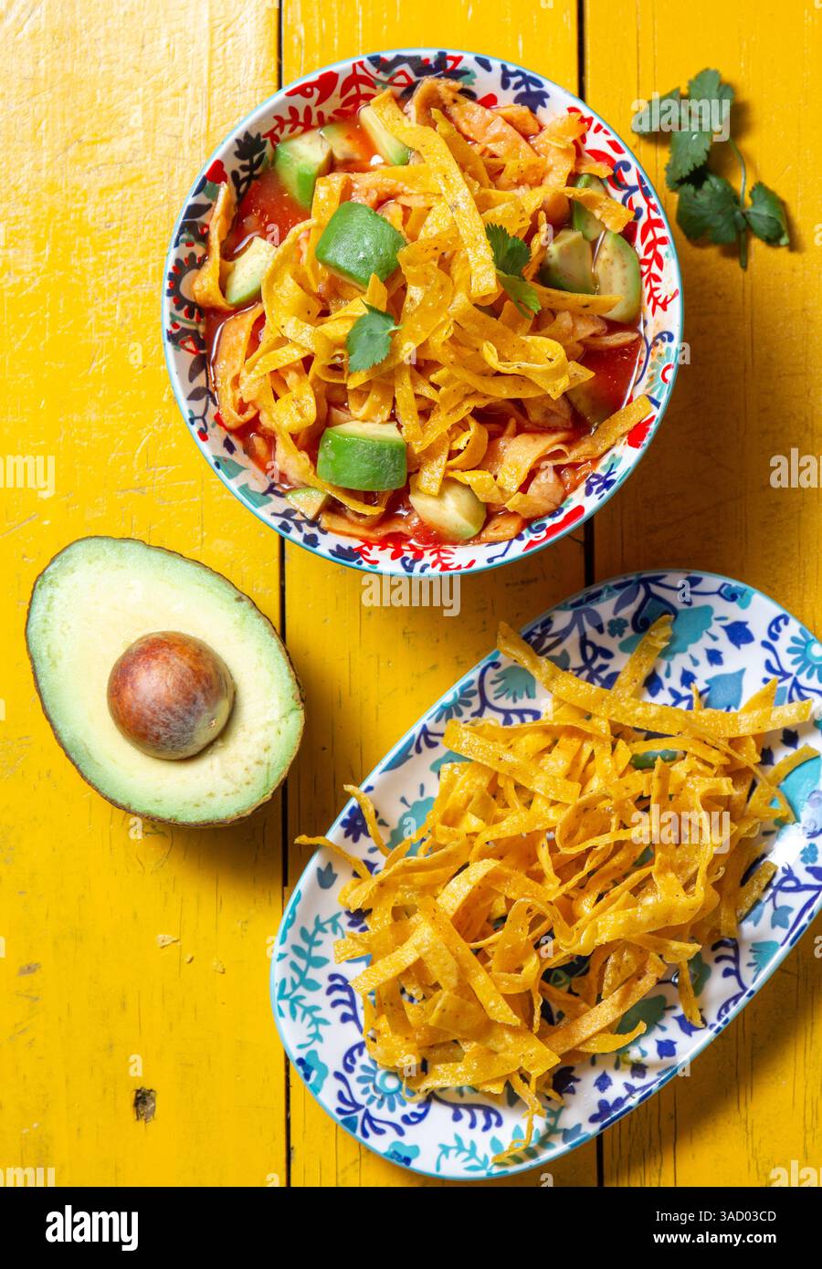 Crispy tortilla topping enhances traditional Aztec soup with vibrant ...