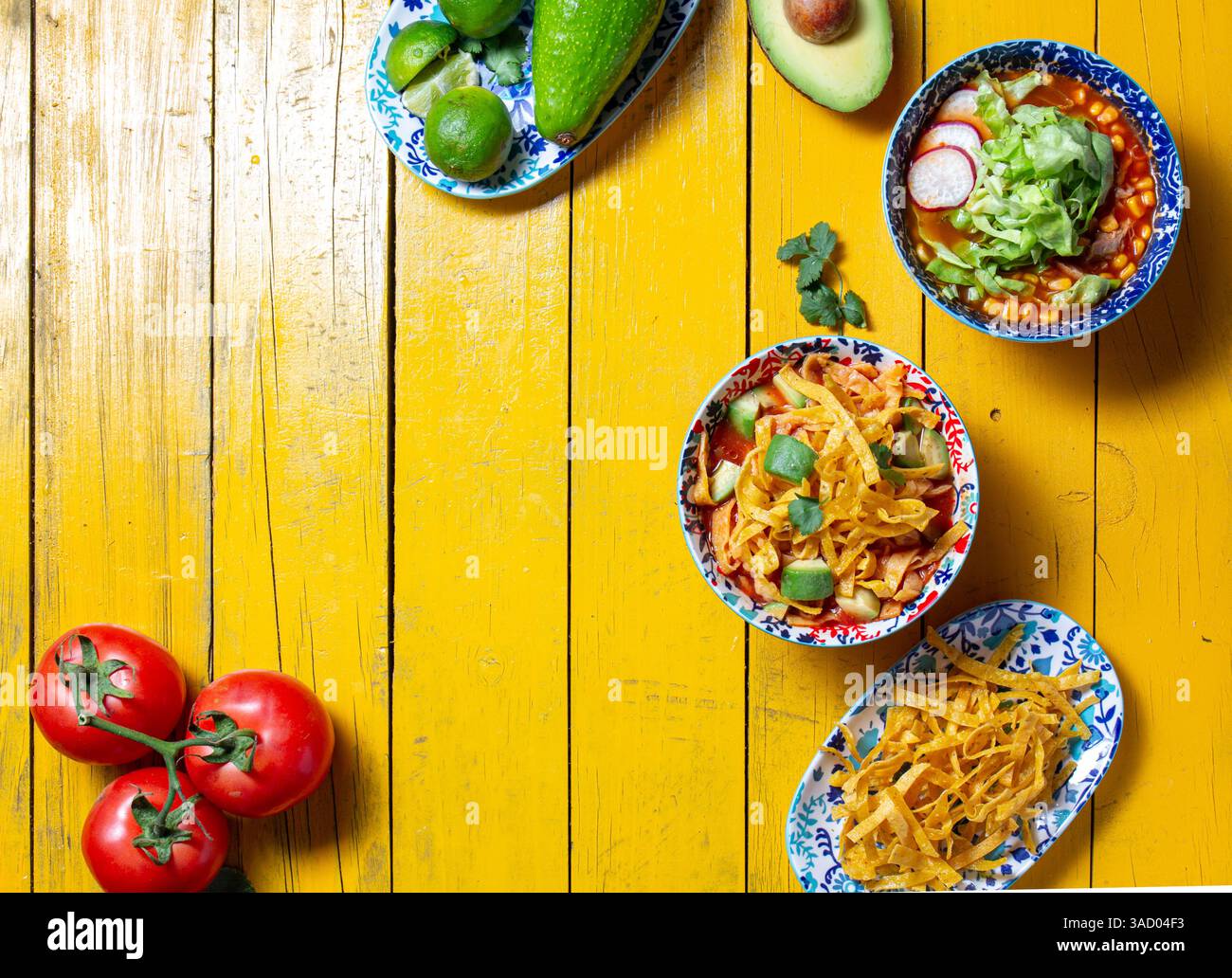 A vibrant spread of traditional Mexican food featuring fried tortilla ...