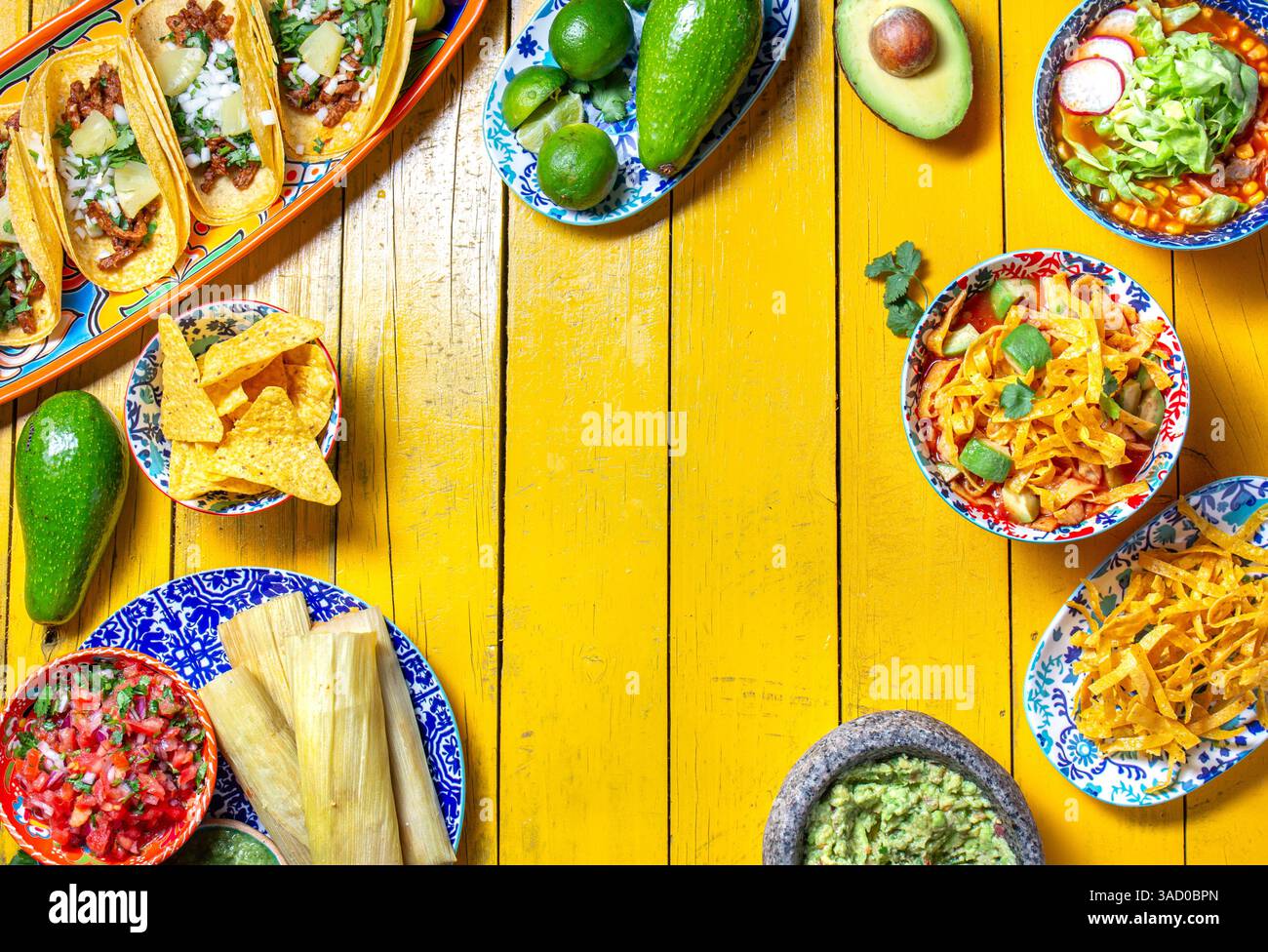 Colorful spread of traditional Mexican dishes featuring tortilla fried ...