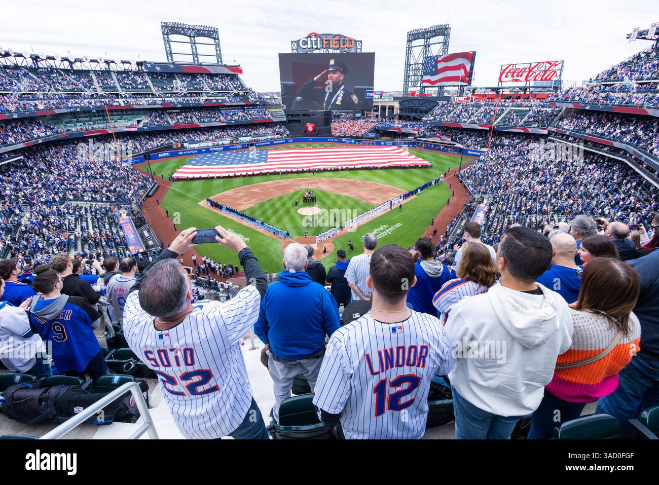 New York Mets fans stand during the National Anthem before an Opening ...