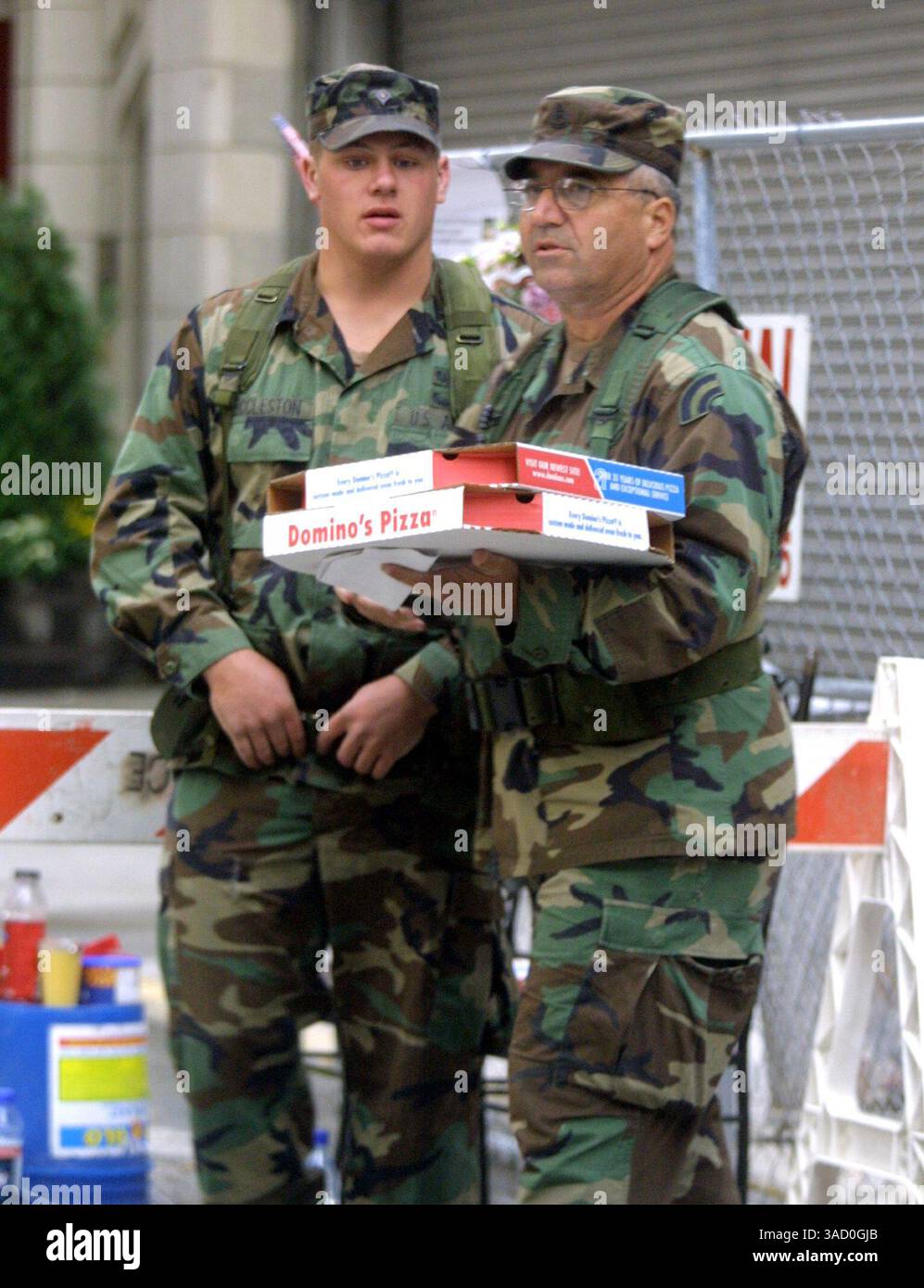 Sep 27, 2001; New York, NY, USA; Soldiers carry Domino's pizza boxes ...