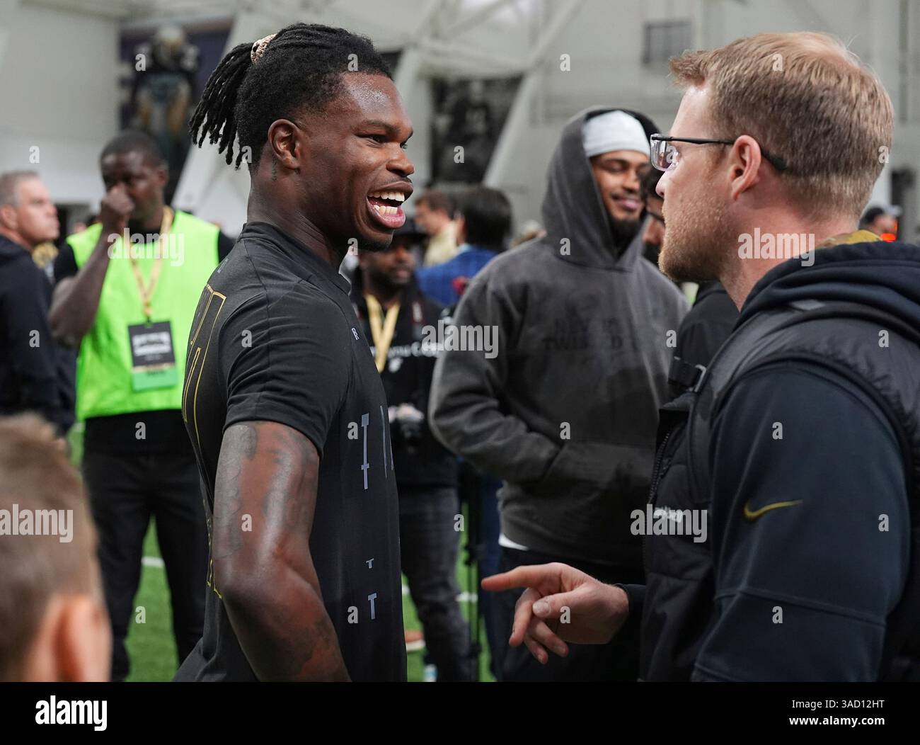 Colorado wide receiver Travis Hunter, left, greets a scout during the ...